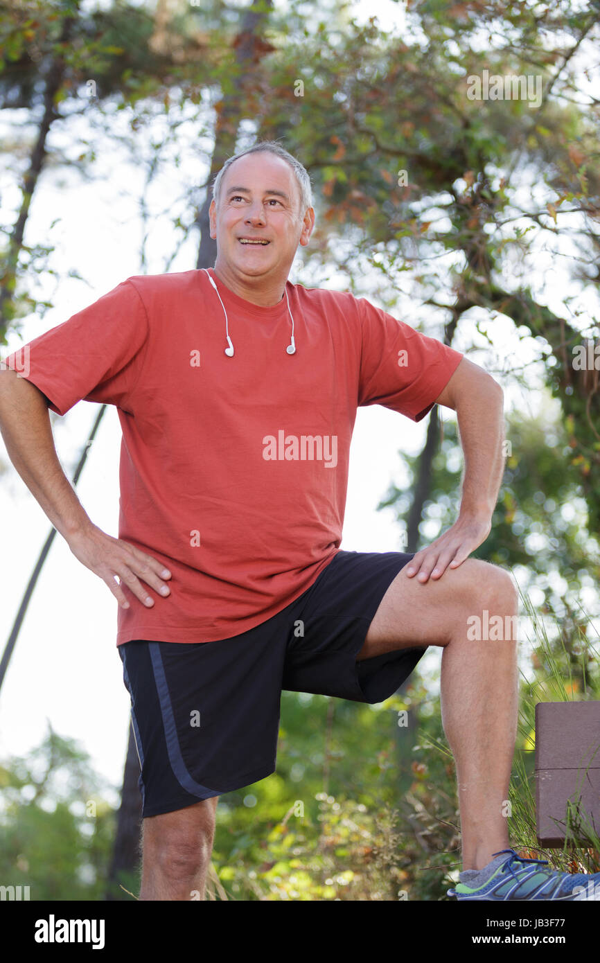 fit male runner posing before running Stock Photo - Alamy
