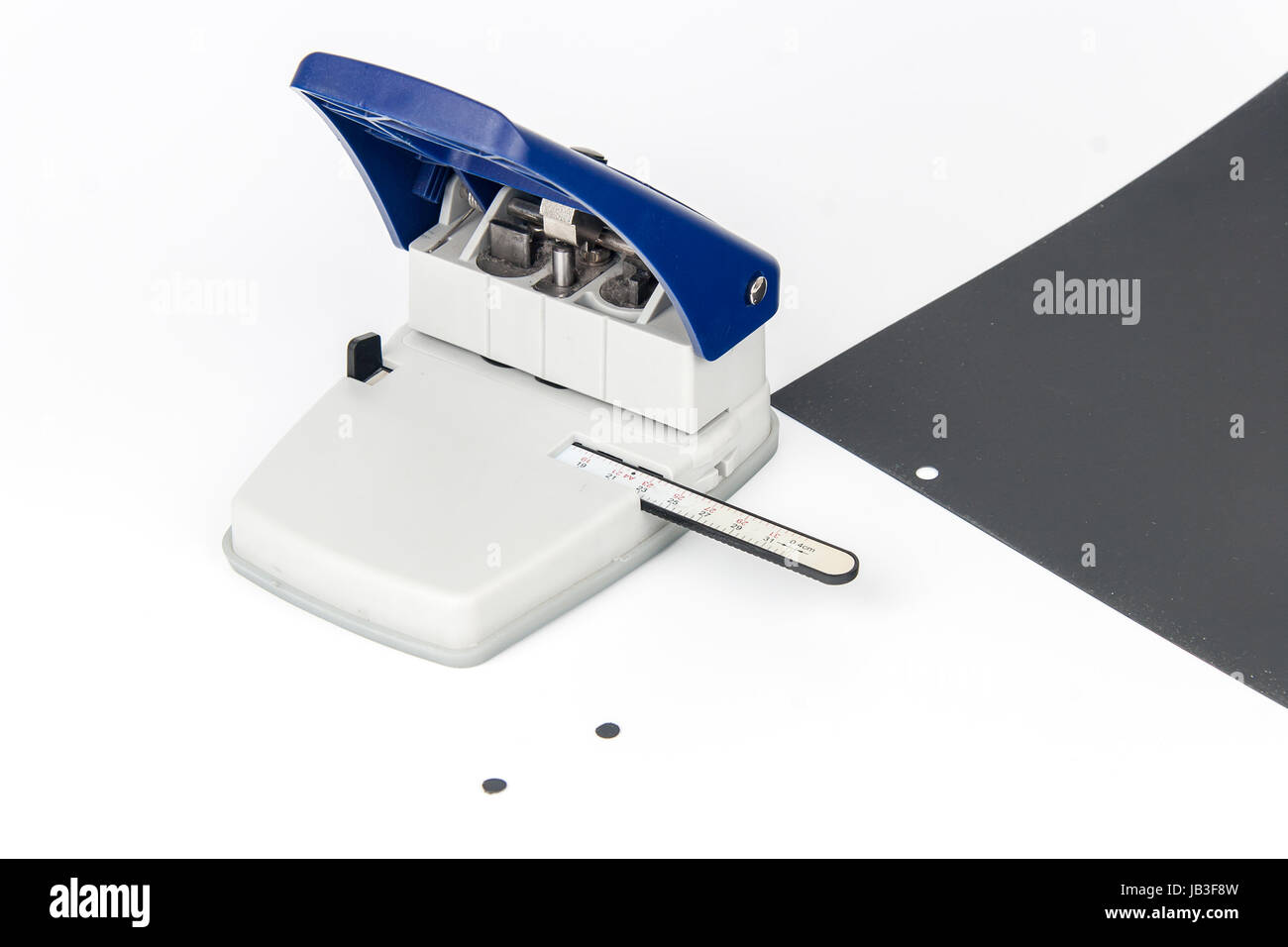 Office Puncher Unit isolated on white background Stock Photo - Alamy