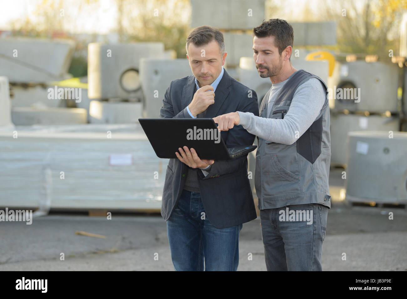 engineer with laptop in the oil field Stock Photo - Alamy