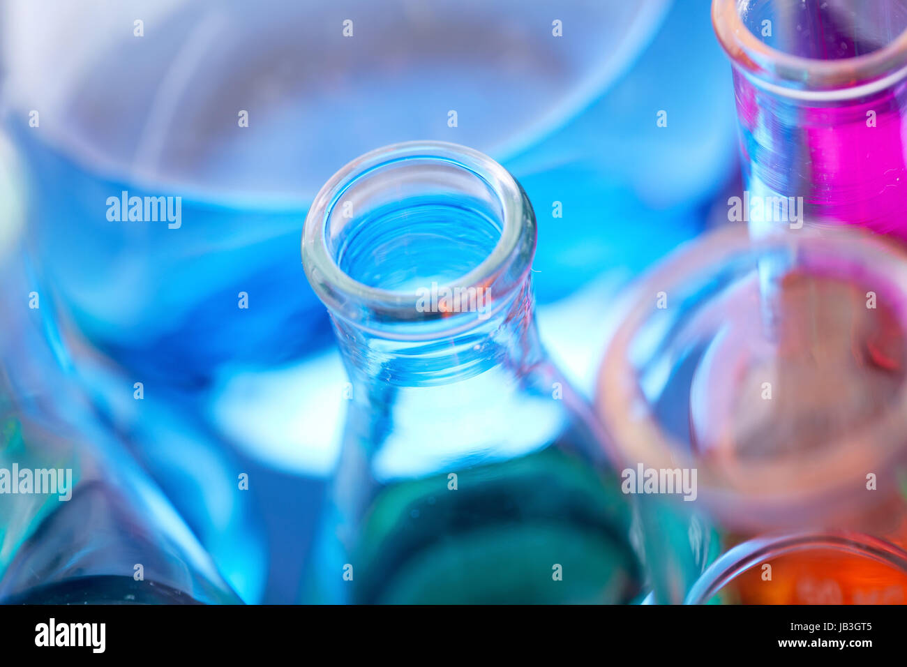 Image of several flasks with multi-color liquids, focus on one of them ... Image of several flasks with multi-color liquids, focus on one of them ...