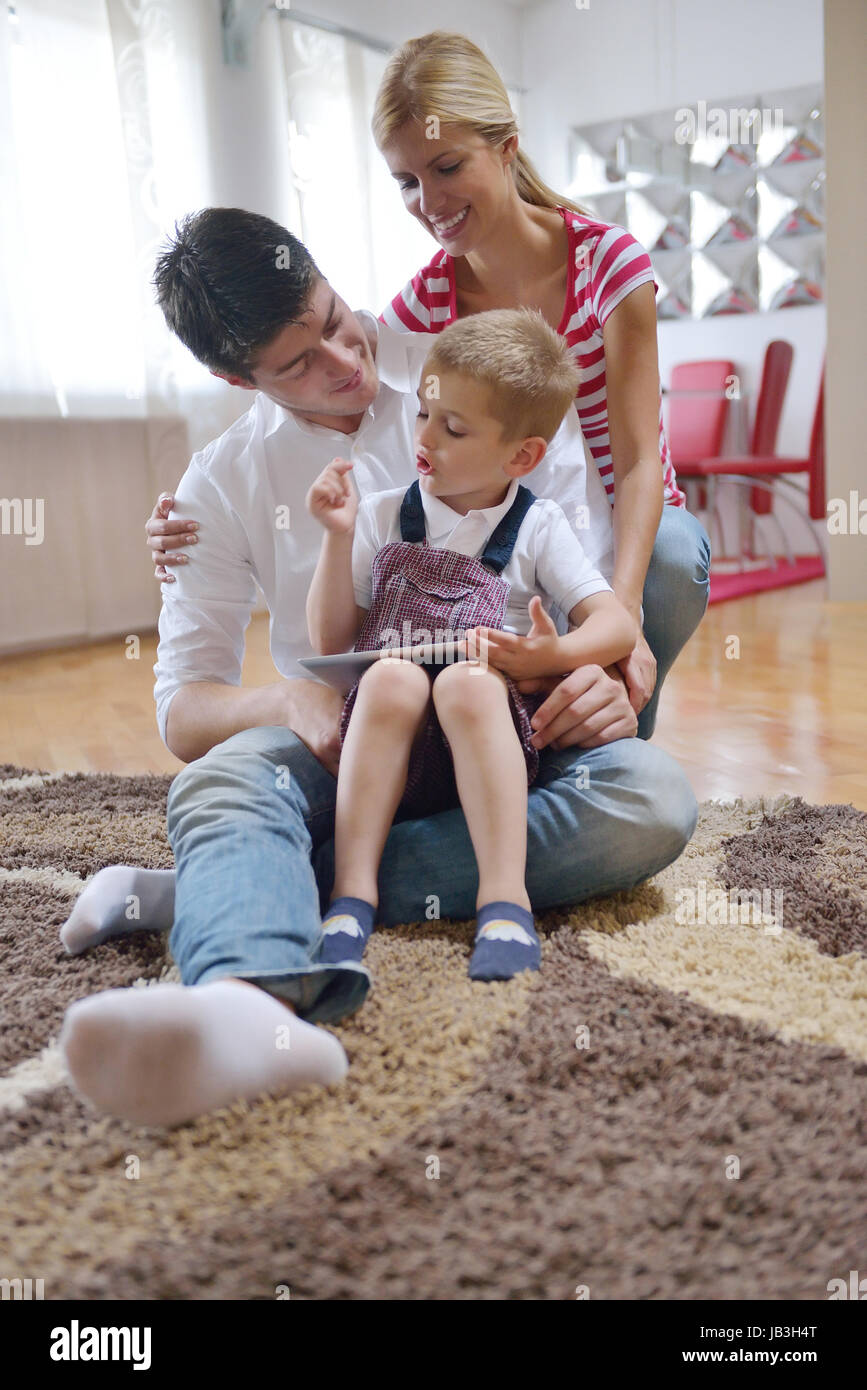 happy young family with kids in bright modern living room have fun and ...