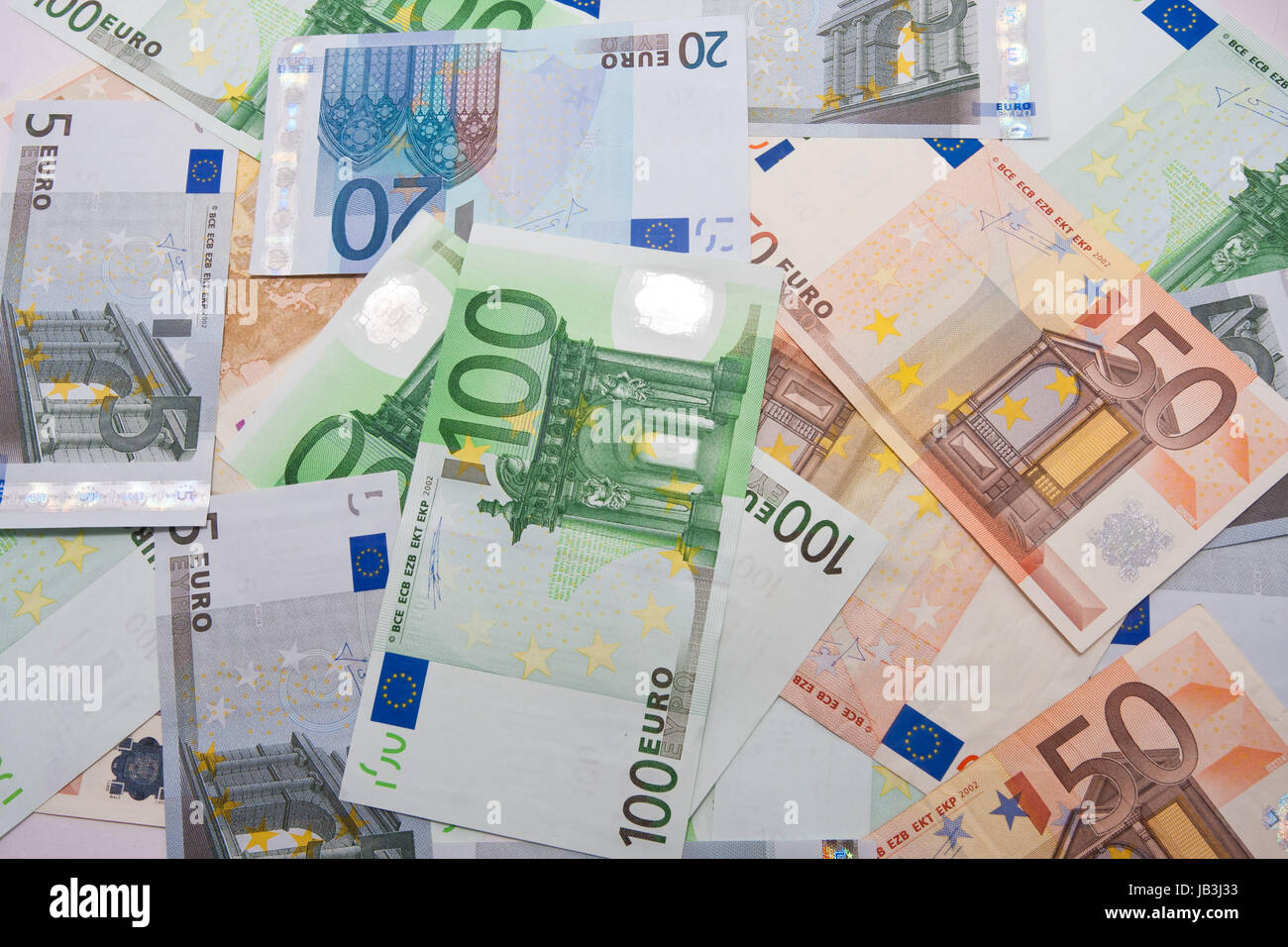 Many euro banknotes making european currency background Stock Photo - Alamy
