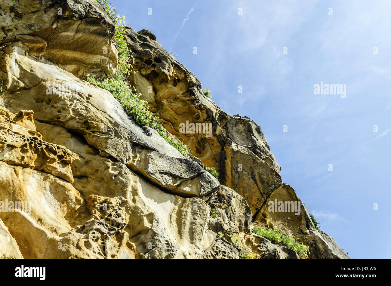 Beautiful yellow rock close to the Atlantic ocean Stock Photo - Alamy