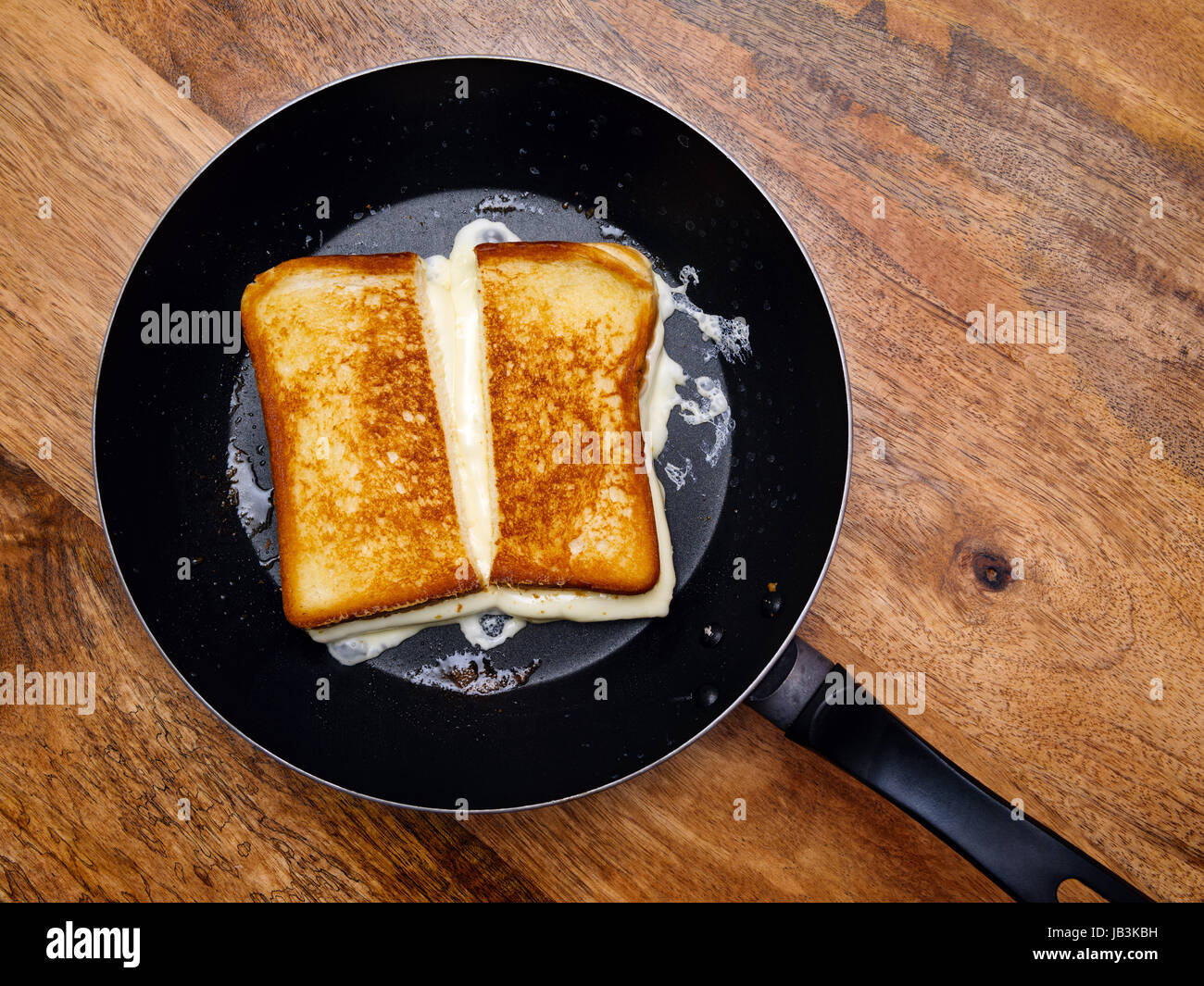 Photo of a grilled cheese sandwich cooking in a large frying pan Stock ...