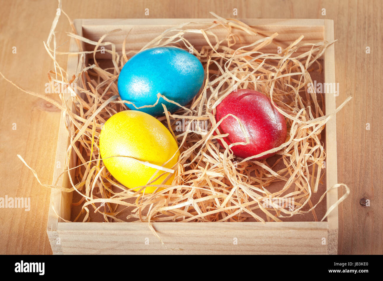 easter eggs in nest in the box Stock Photo - Alamy