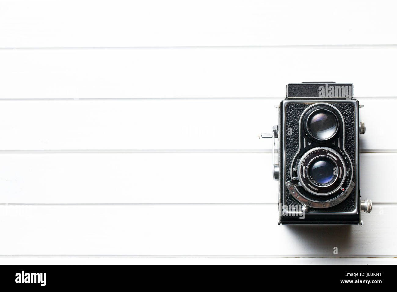 top view of old camera on white wooden background Stock Photo - Alamy
