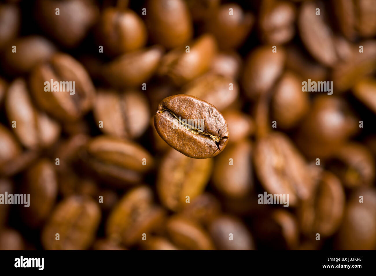 top view of coffee bean on coffee beans background Stock Photo - Alamy