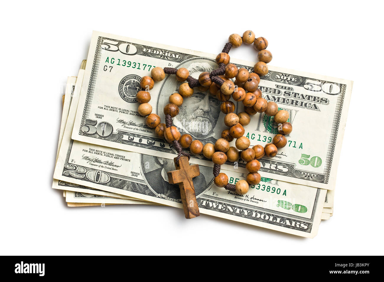rosary with american dollars on white background Stock Photo - Alamy