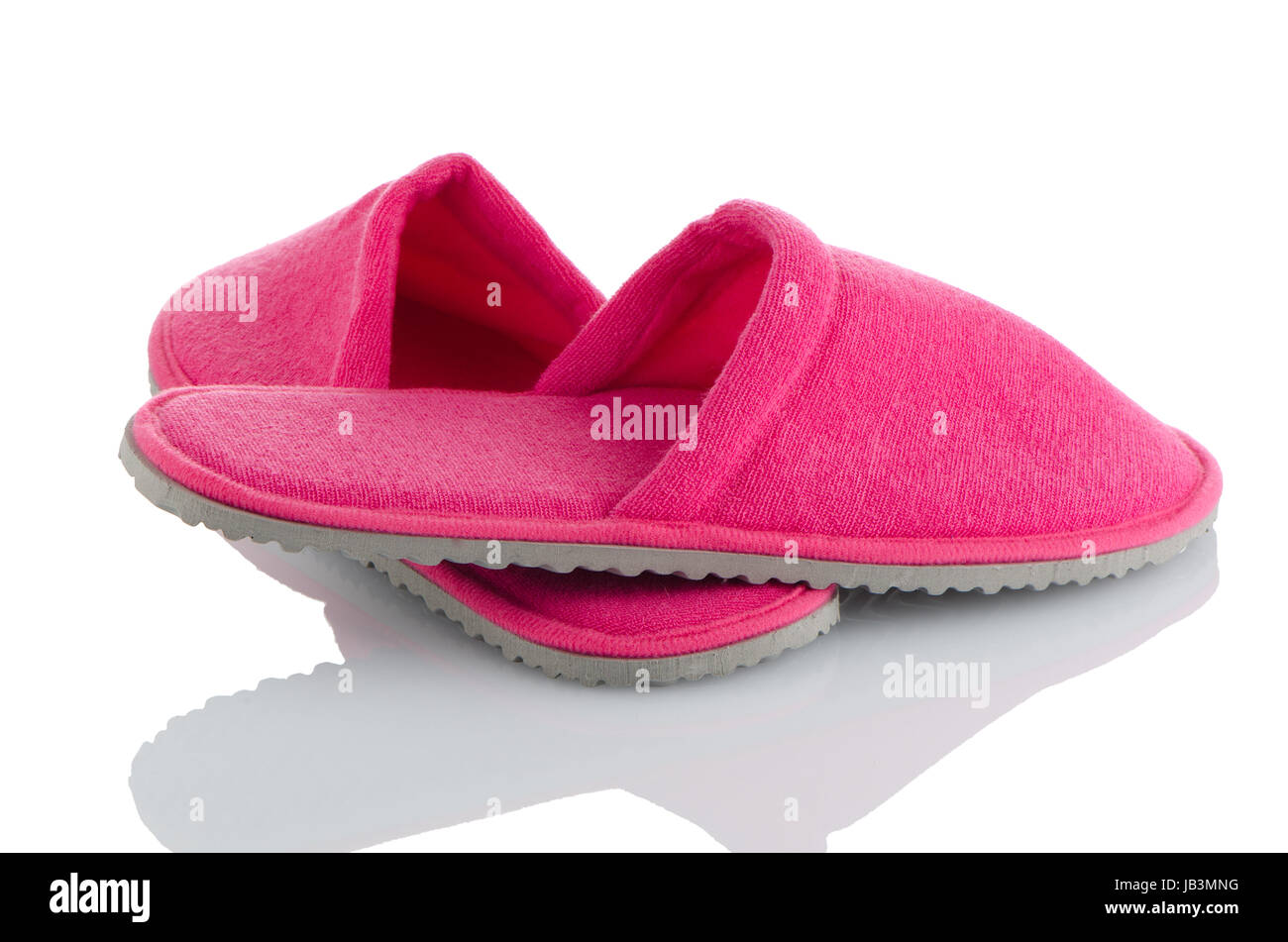 A pair of pink slippers on a white background Stock Photo - Alamy