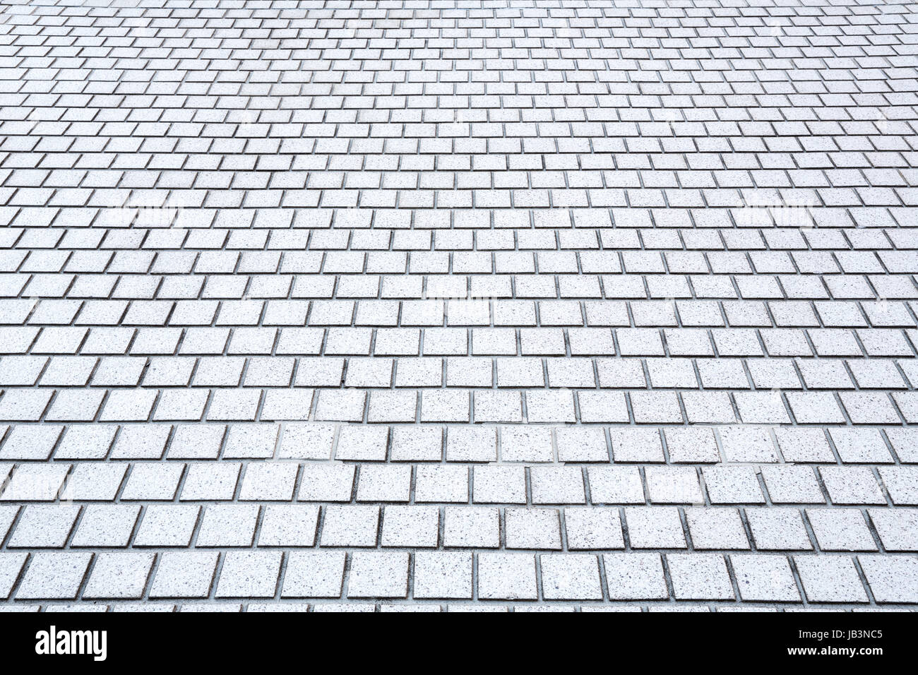 Perspective of concrete brick pavement road Stock Photo - Alamy