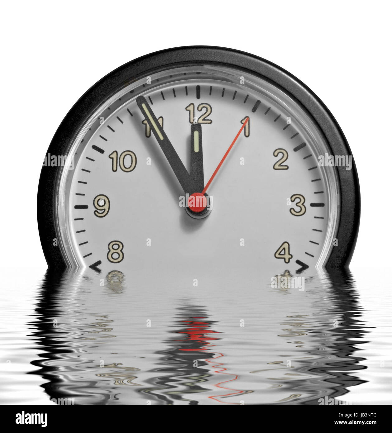 a partly sunken clock showing five minutes to twelve on reflective ...