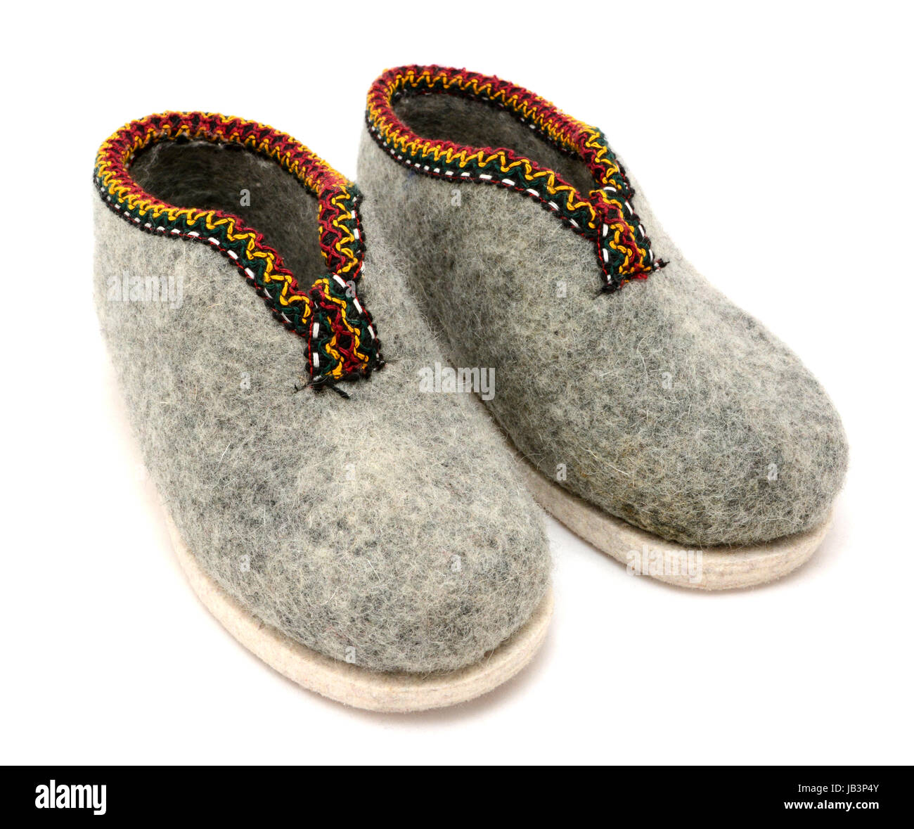 Pair of traditional Austrian embroidered felt slippers, isolated on ...
