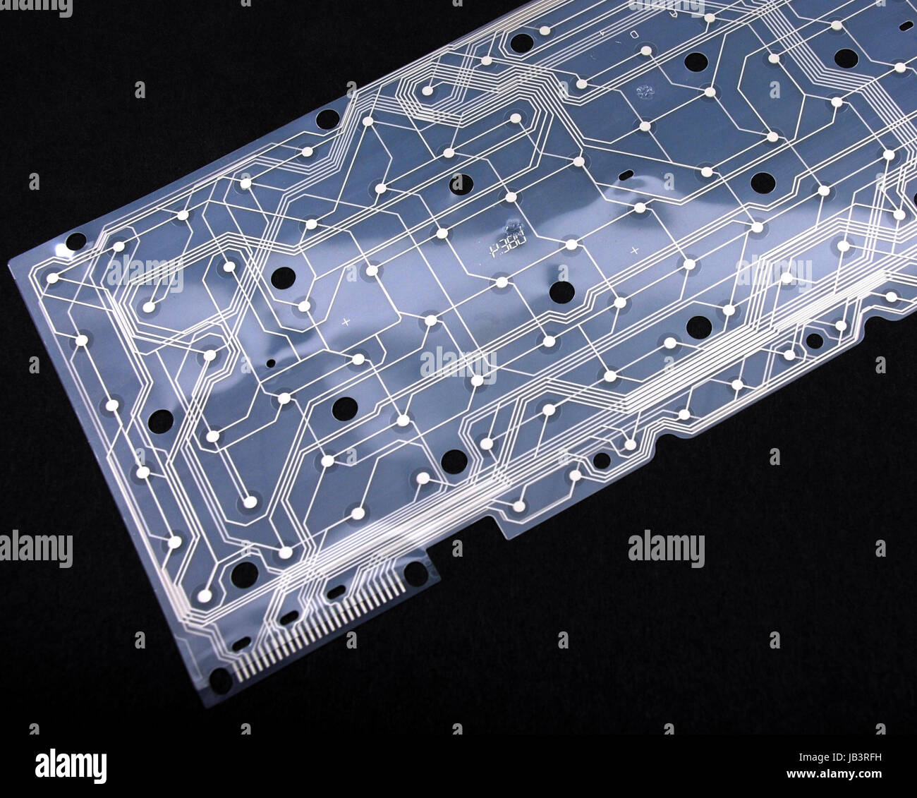 Interior of a computer keyboard showing the connections for the keys ...