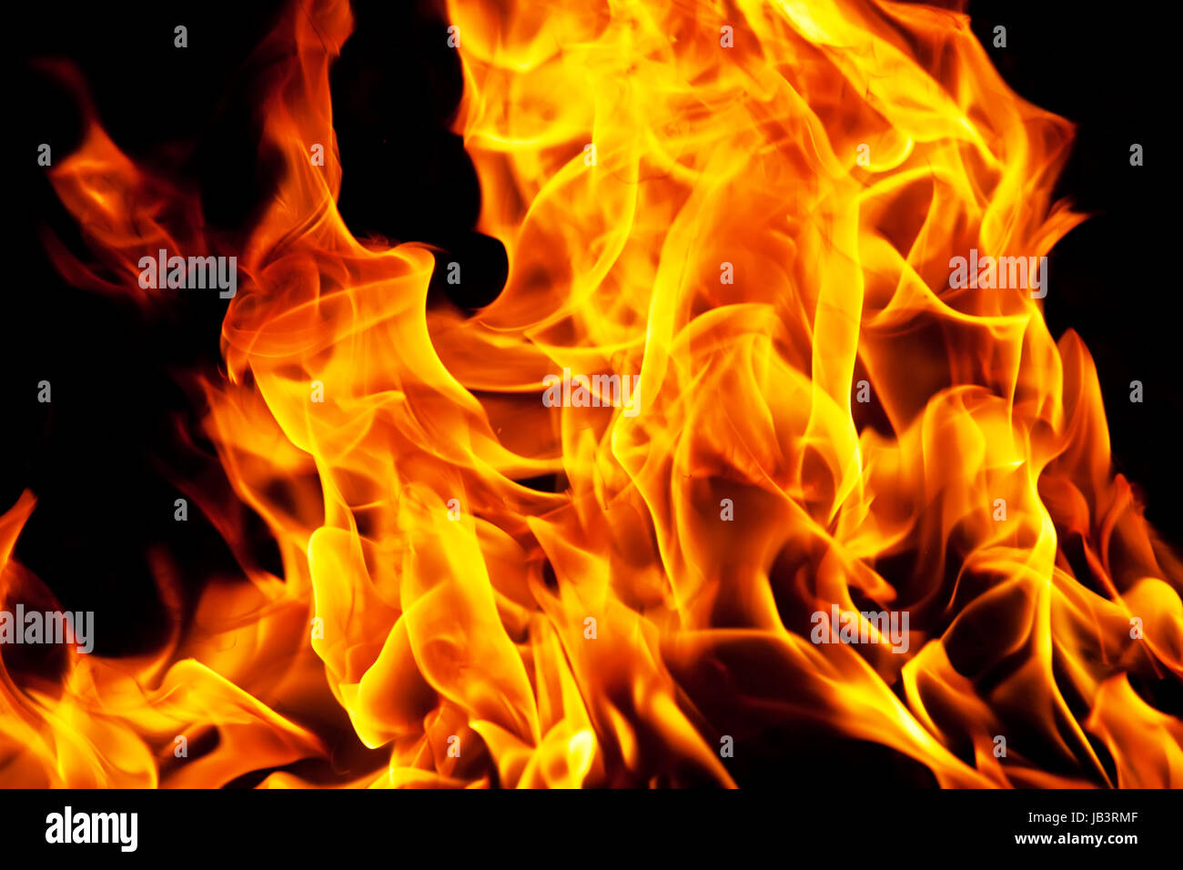 Beautiful yellow and orange hot fire on black background Stock Photo ...