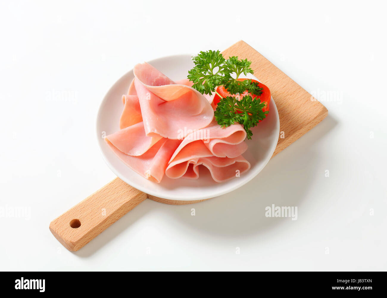 Thinly sliced ham - studio shot Stock Photo - Alamy