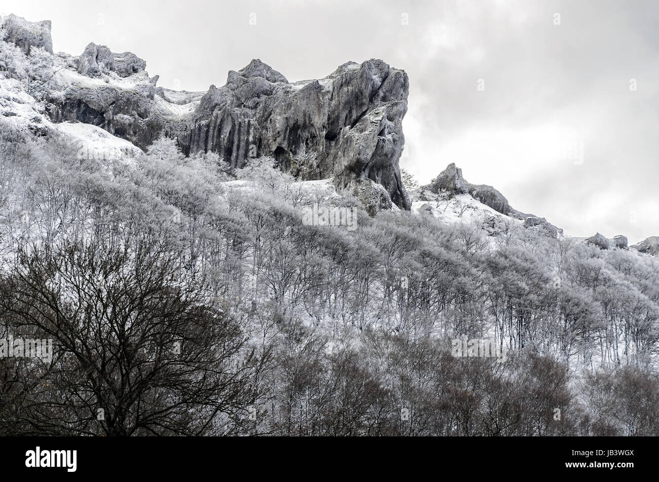 Beautiful winter picture at the rocks on the mountain. They are covered ...