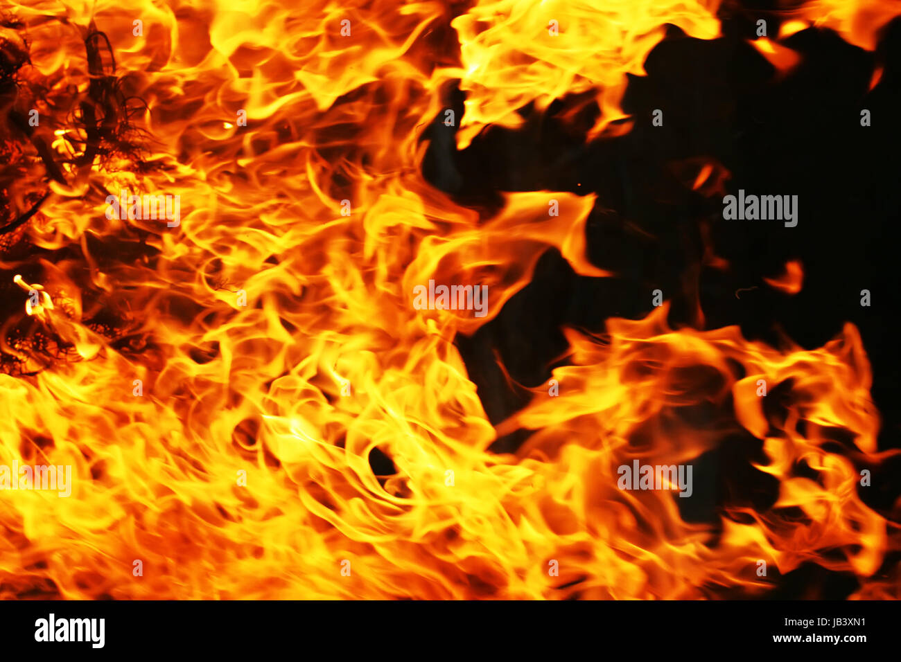 Beautiful yellow and orange hot fire on black background Stock Photo ...