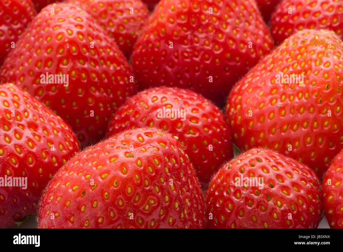 Red sweet strawberries making nice edible background Stock Photo - Alamy
