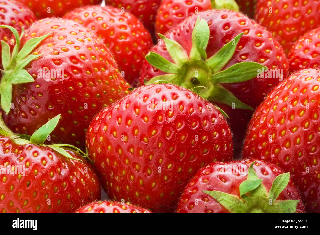 Red sweet strawberries making nice edible background Stock Photo - Alamy
