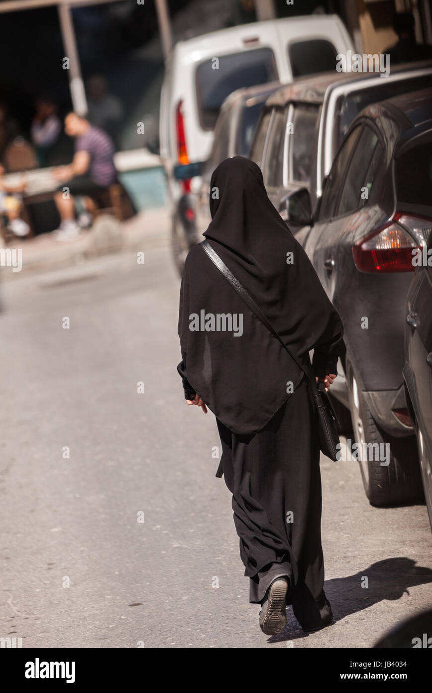 Muslim woman in Istanbul neighborhood wearing a hijab Stock Photo - Alamy