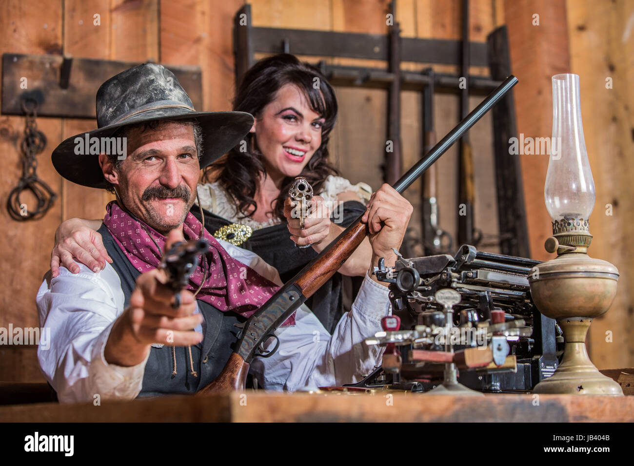 Smiling Sheriff Stands With Woman and a Loaded Gun Stock Photo - Alamy