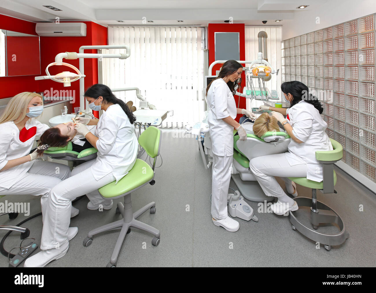 Dentists at work in modern dental office Stock Photo - Alamy