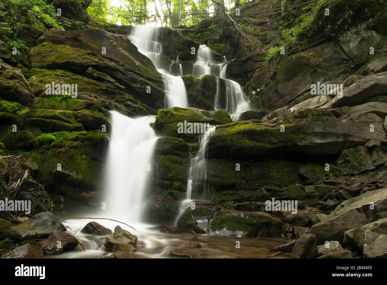 Stream water runs over stones hi-res stock photography and images - Alamy