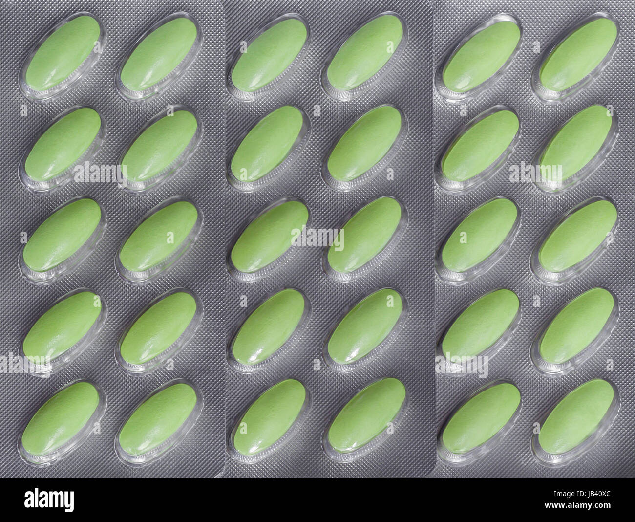 Closeup green pills color in blister pack Stock Photo - Alamy
