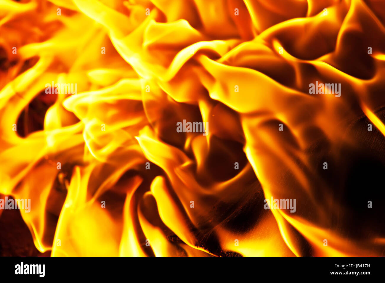 Beautiful yellow and orange hot fire on black background Stock Photo ...