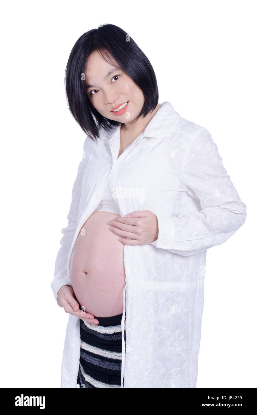 Beautiful pregnant woman expecting isolated over white background Stock ...