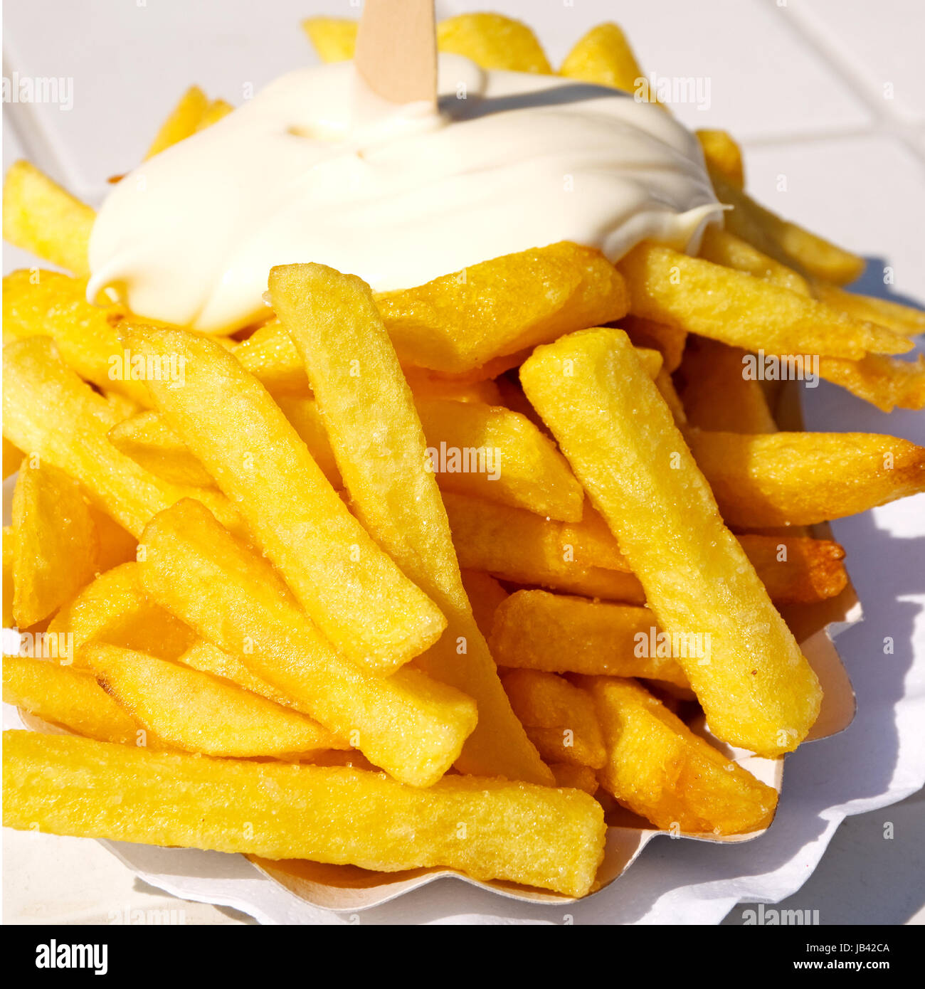 yellow pommes frites with mayonnaise in close-up Stock Photo - Alamy