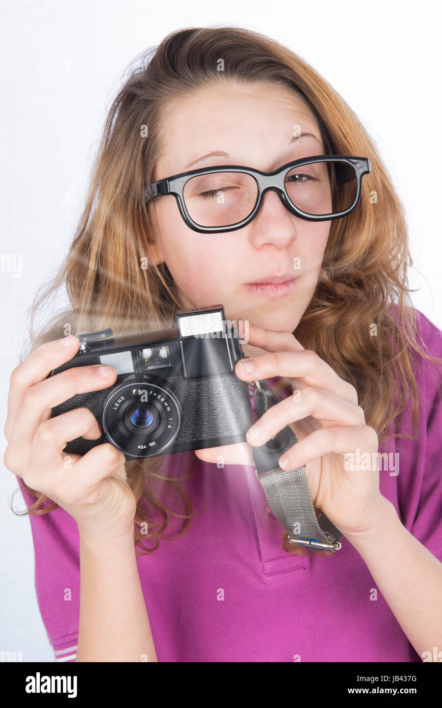 Young nerd photographer with camera in hand which make a flash Stock ...