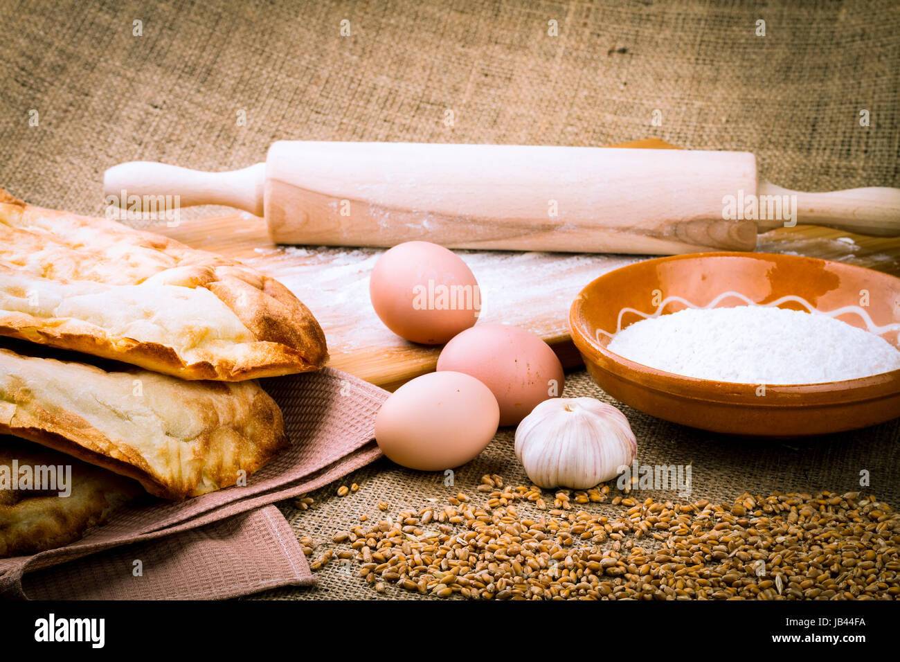 fresh pita bread isolated on sacking background Stock Photo - Alamy