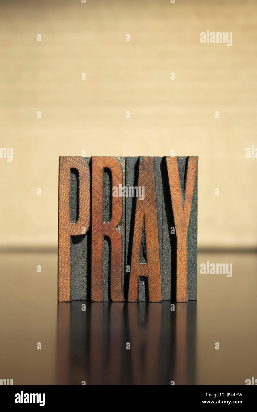 The word PRAY written in vintage letterpress type Stock Photo - Alamy