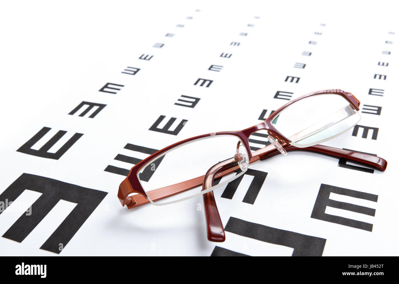 Eyeglasses and eye chart Stock Photo - Alamy