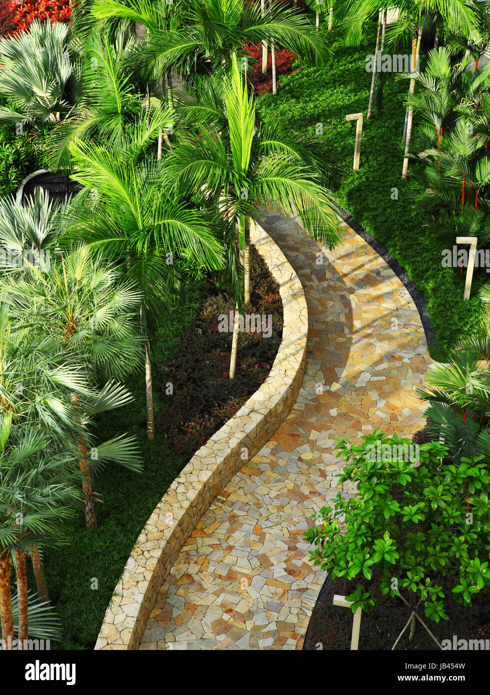 Stone path in green tree garden Stock Photo - Alamy