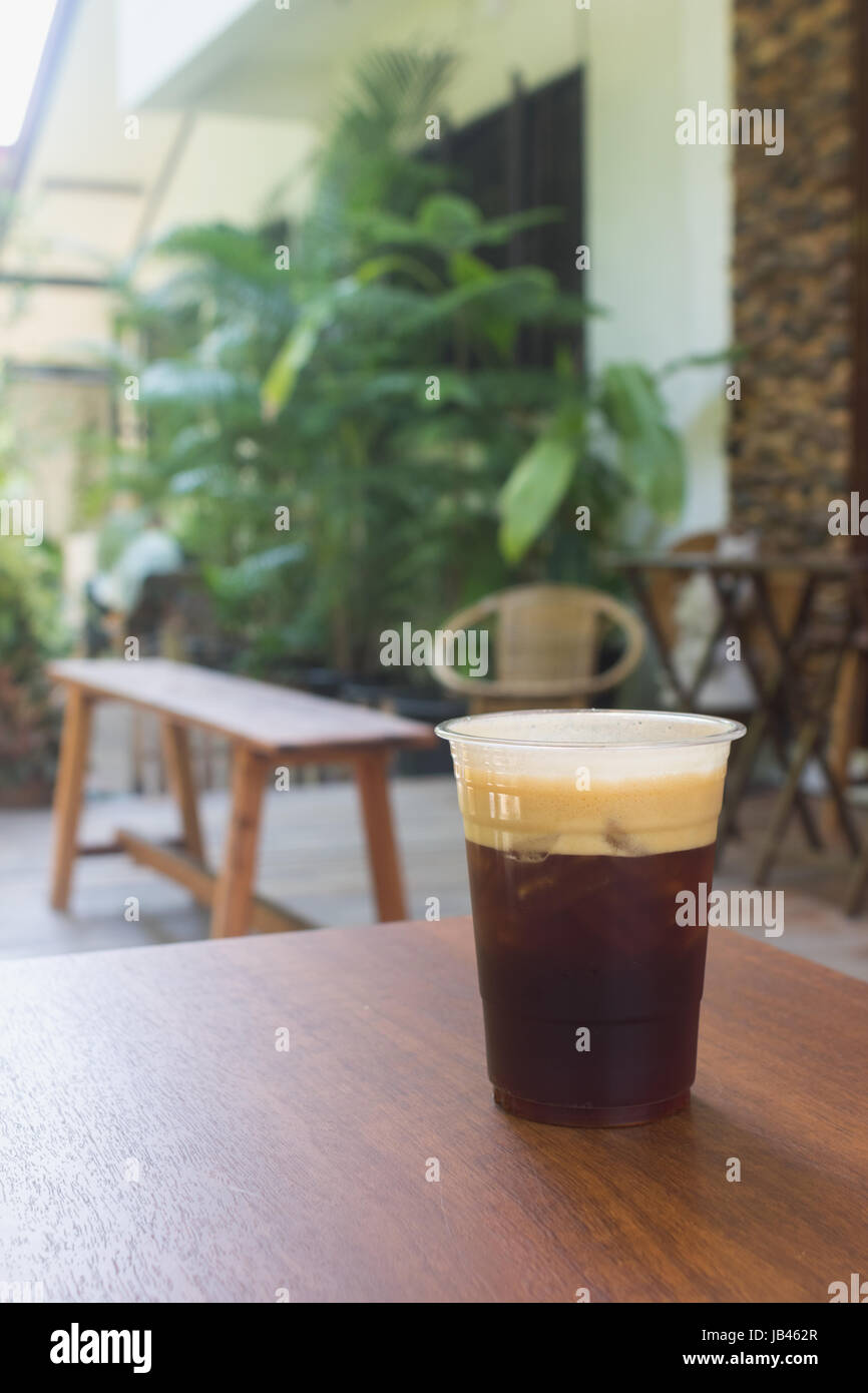 Sparkling Nitro Cold Brew Coffee on wooden table outdoor cafe Stock ...