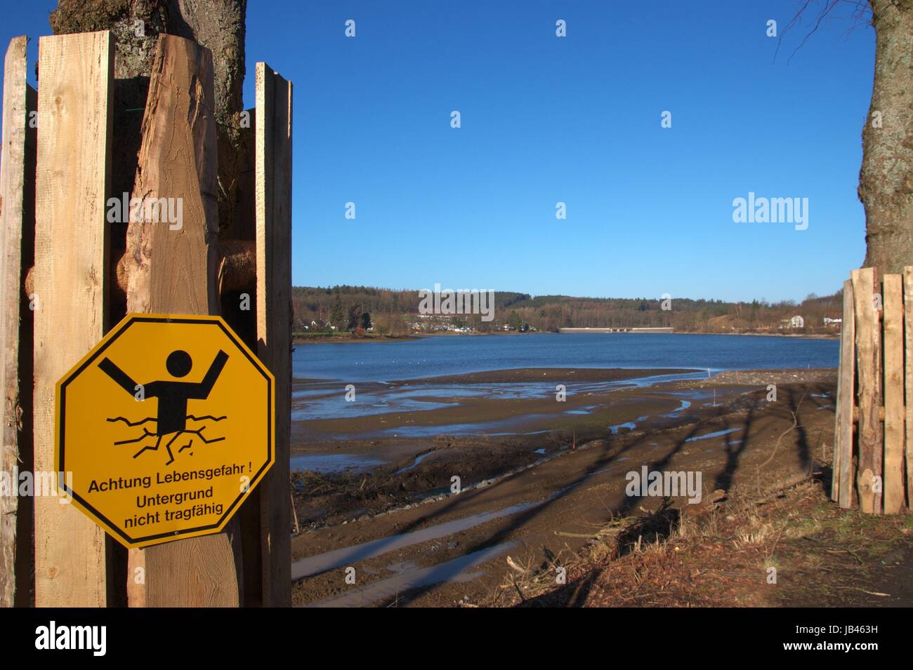 warning sign on the lake Stock Photo - Alamy