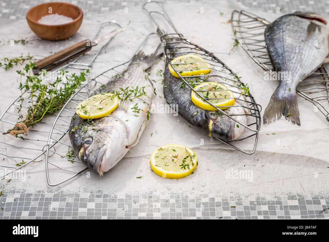 Freshly caught sea bream with herbs for grill Stock Photo - Alamy