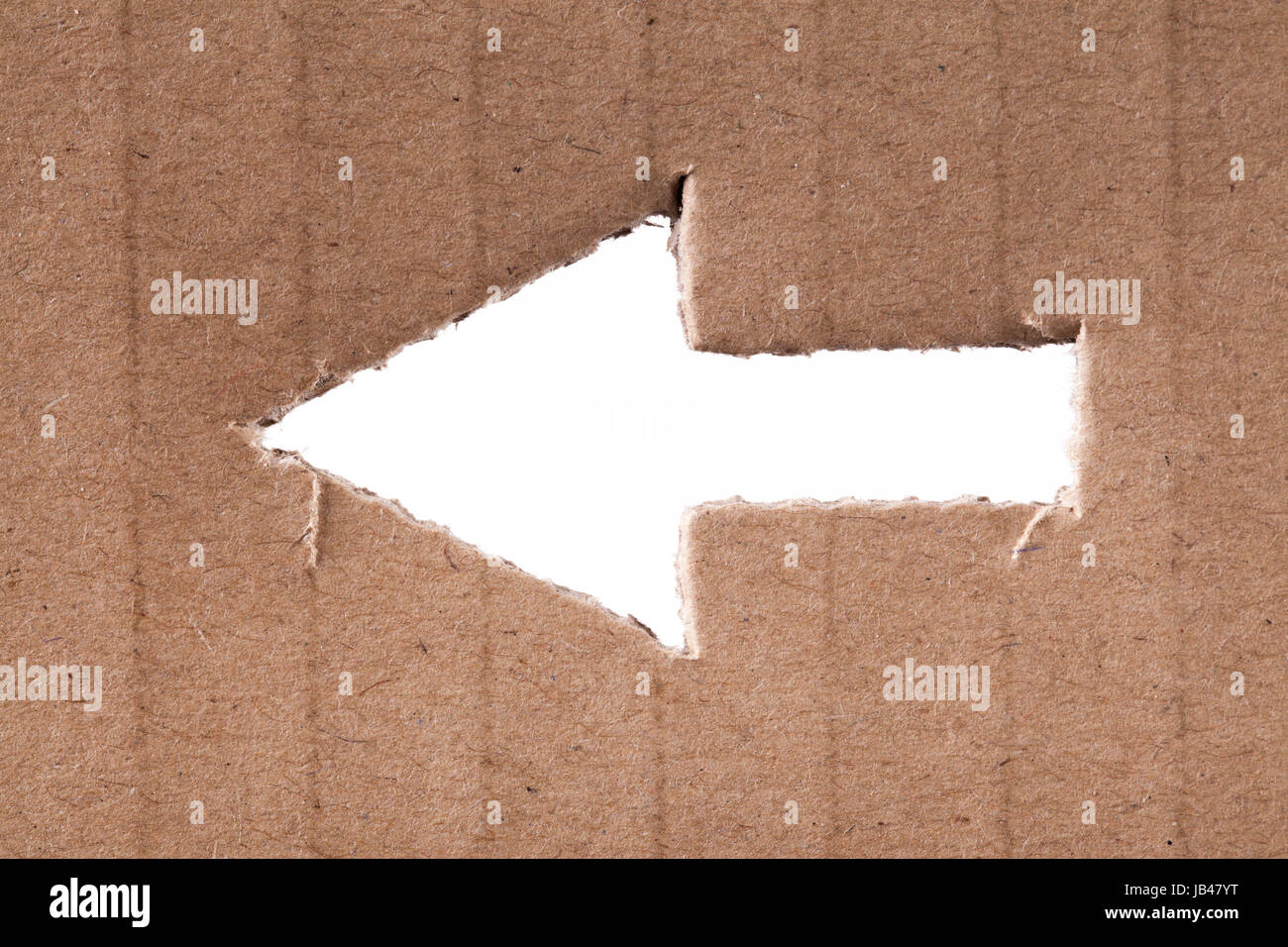 Arrow shape in cardboard with a white background Stock Photo - Alamy