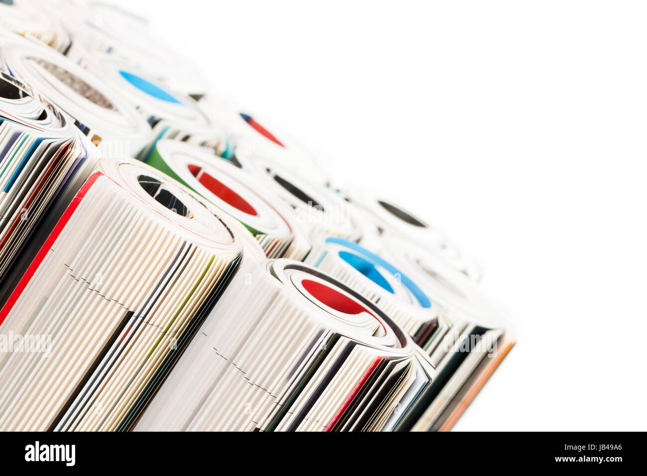 Stack of color magazines on white background Stock Photo - Alamy