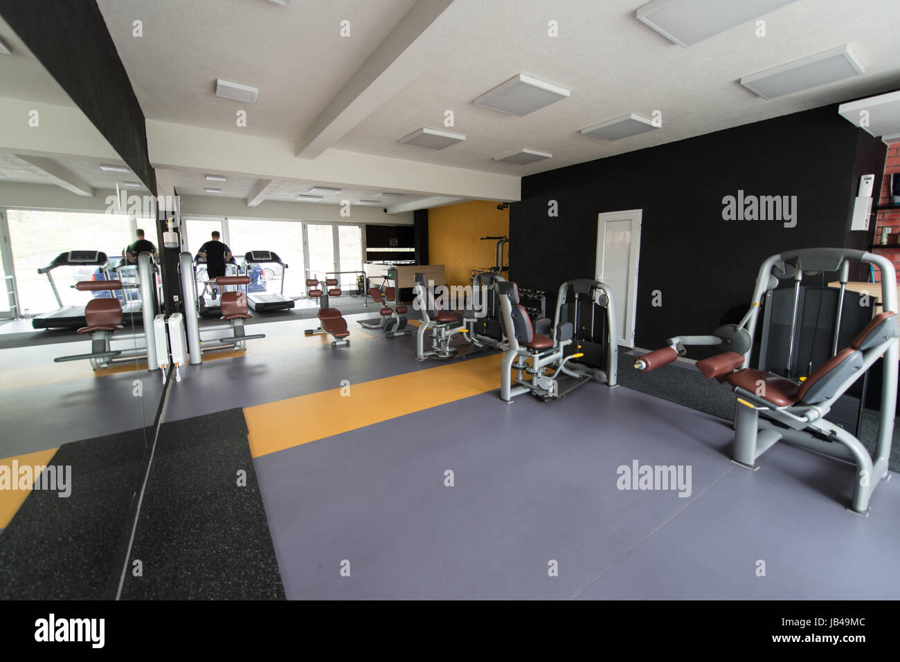 Modern Gym Room Fitness Center With Equipment And Machines Stock Photo ...