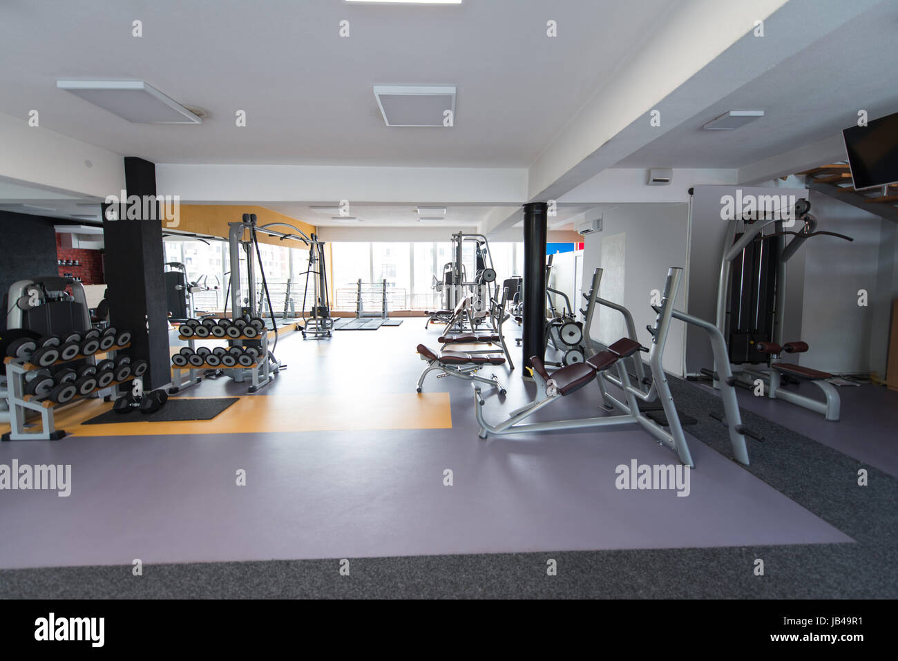 Modern Gym Room Fitness Center With Equipment And Machines Stock Photo ...