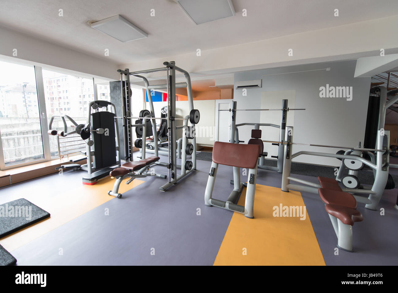 Modern Gym Room Fitness Center With Equipment And Machines Stock Photo ...