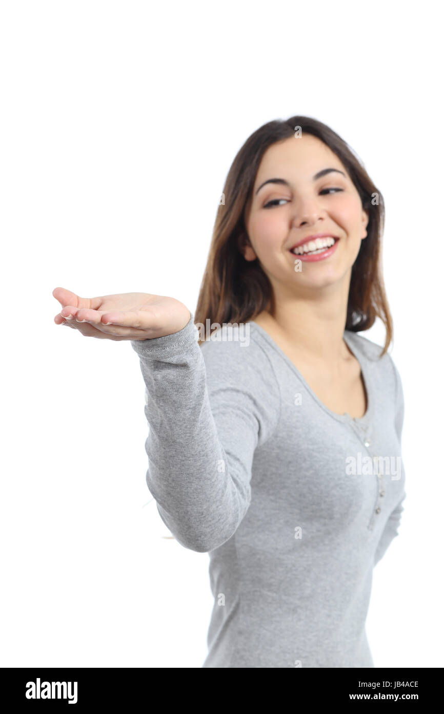 Woman holding something from her hand isolated on a white background ...