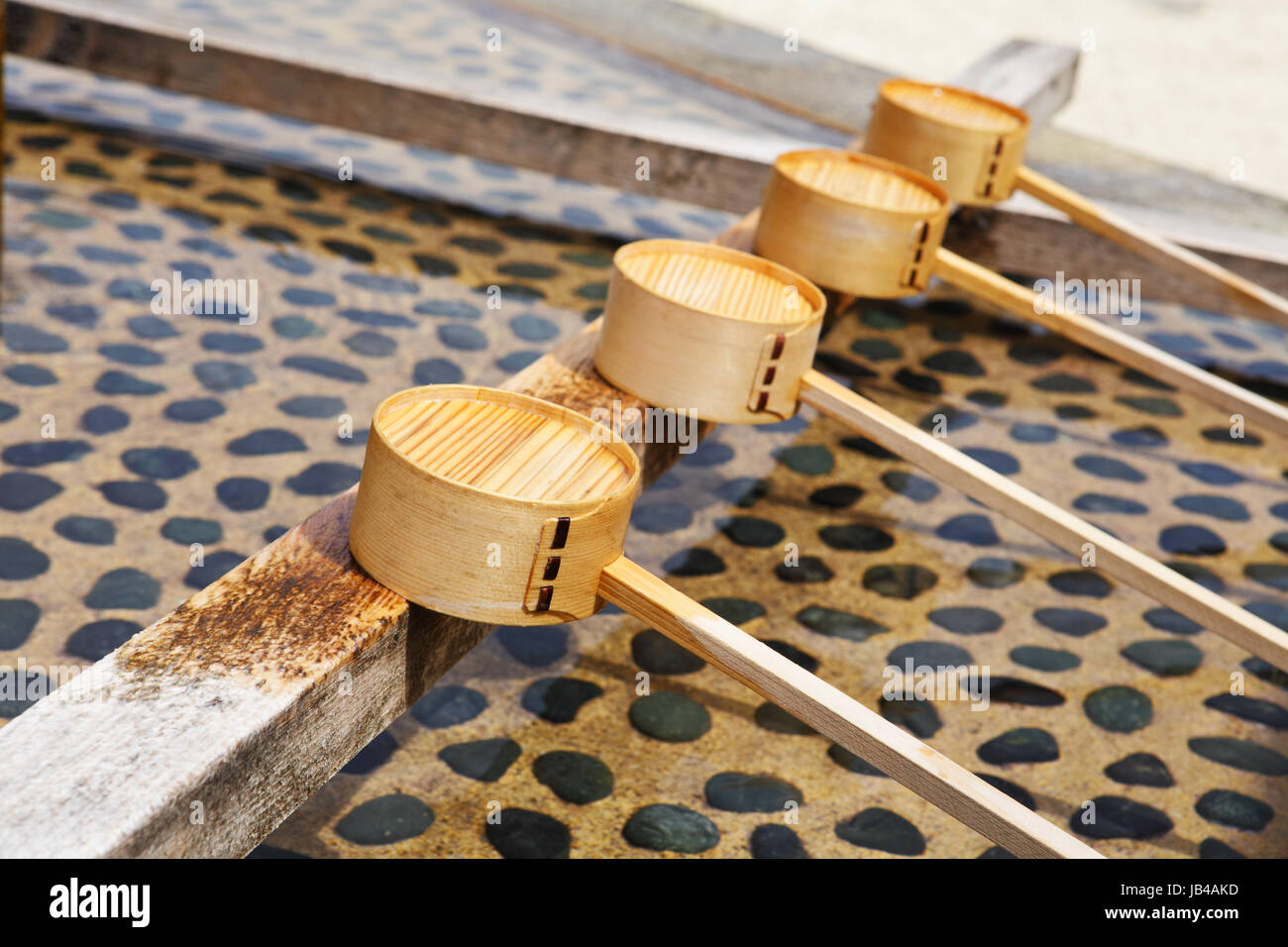 Traditional purification dipper in Japanese temple Stock Photo - Alamy