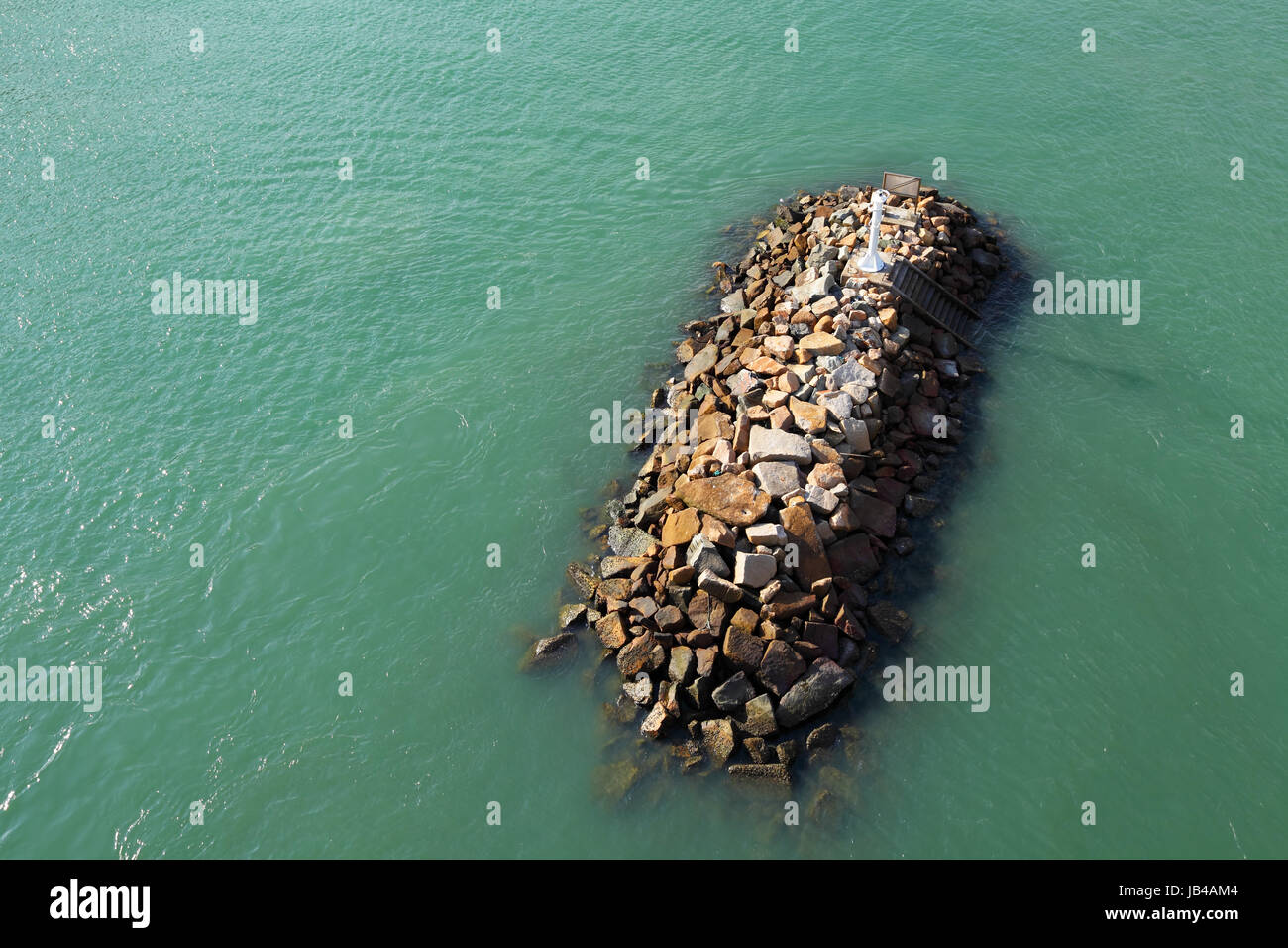 Wave breaker stone Stock Photo - Alamy