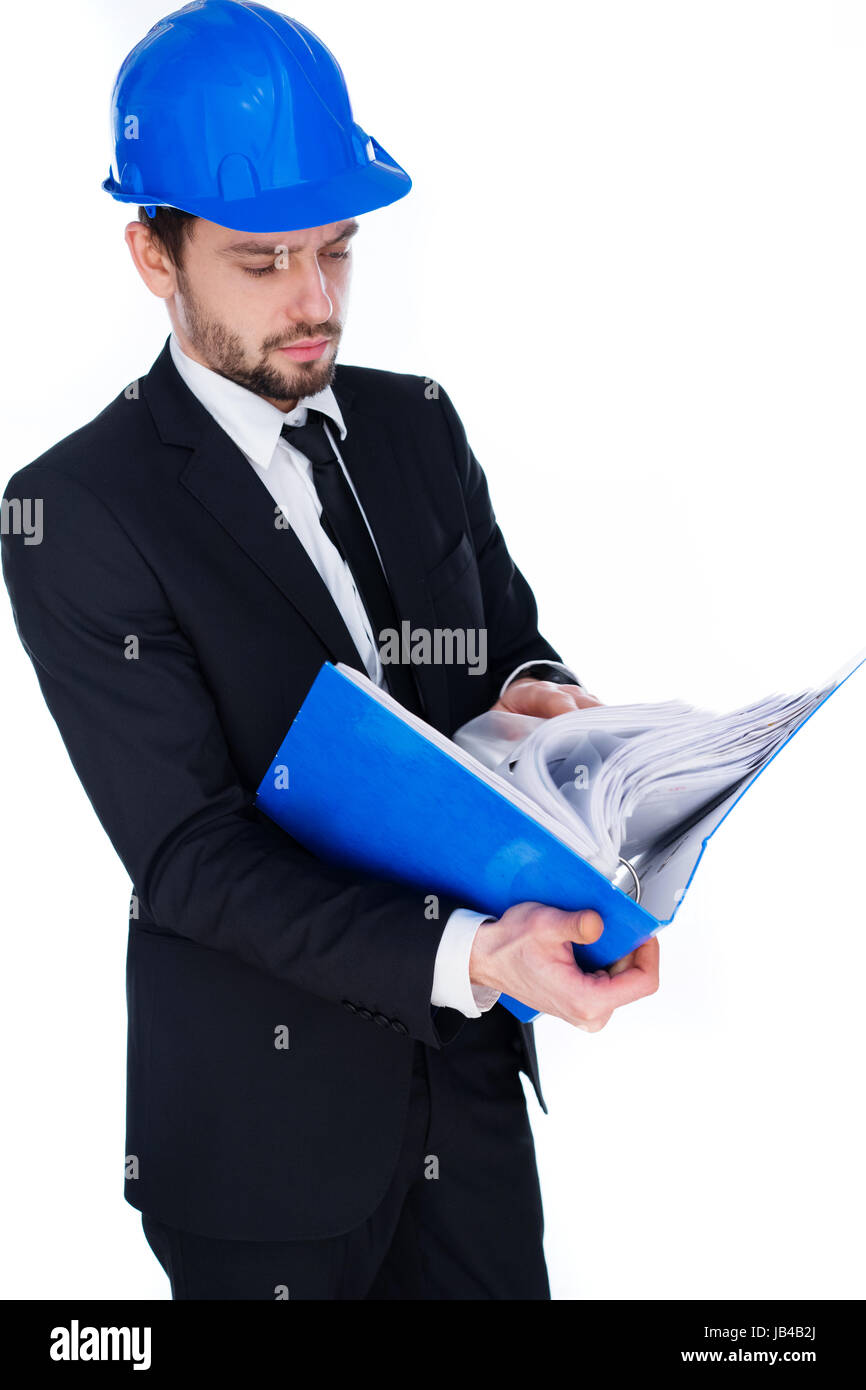 Handsome young structural engineer or architect standing in a suit and ...