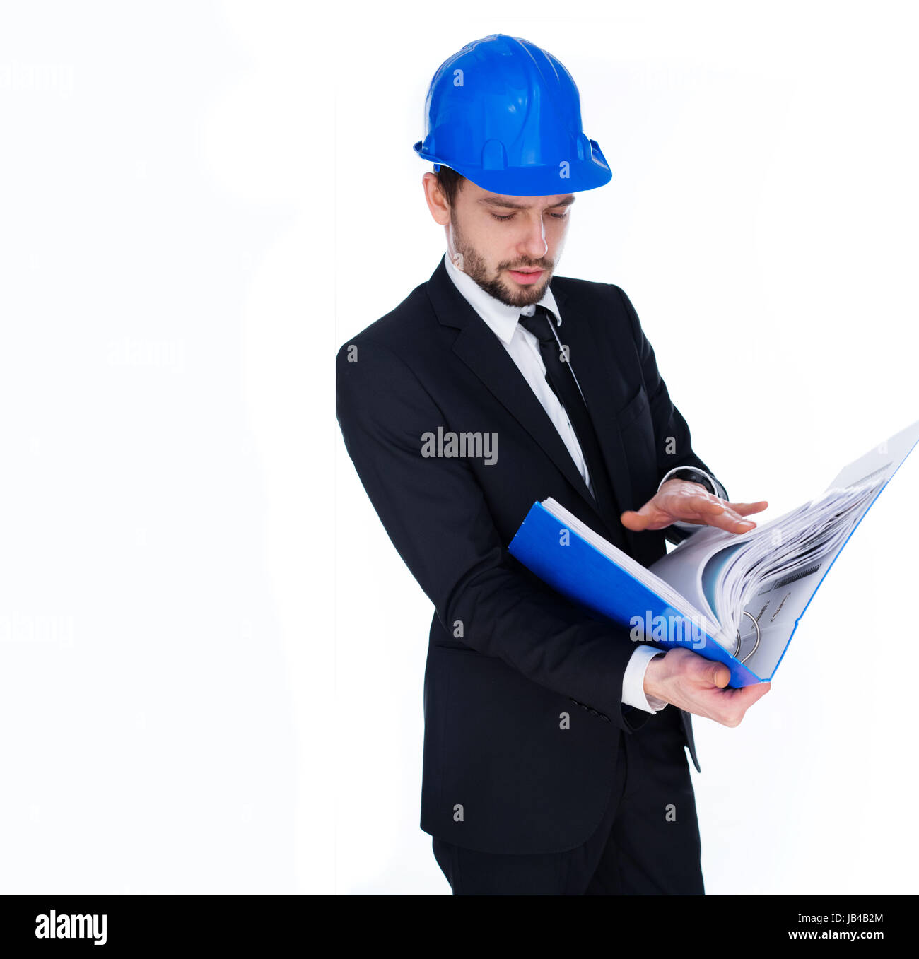 Handsome young structural engineer or architect standing in a suit and ...