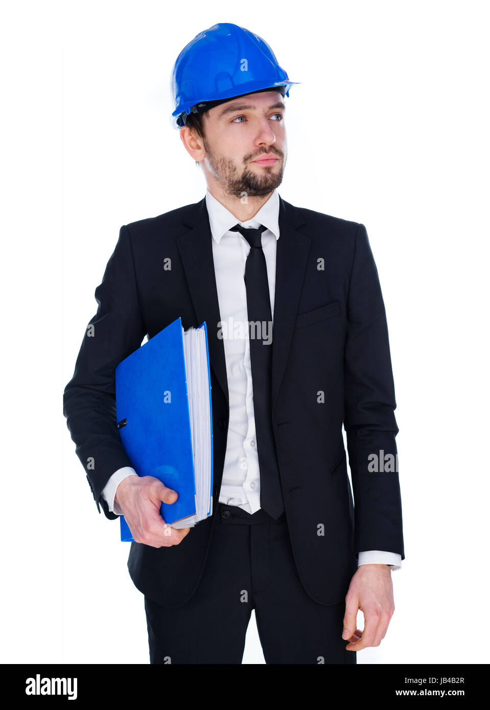 Contemplative young architect or structural engineer standing holding a ...